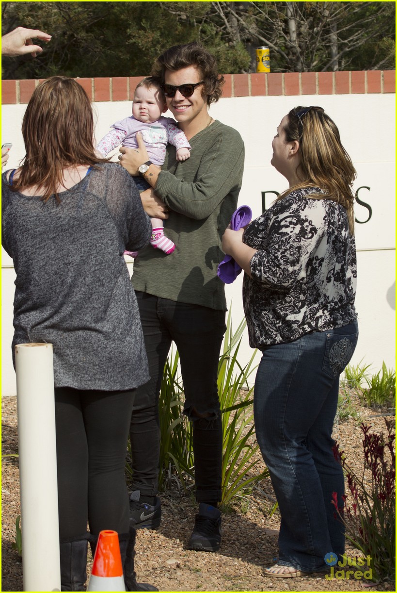 One Direction Holding Babies