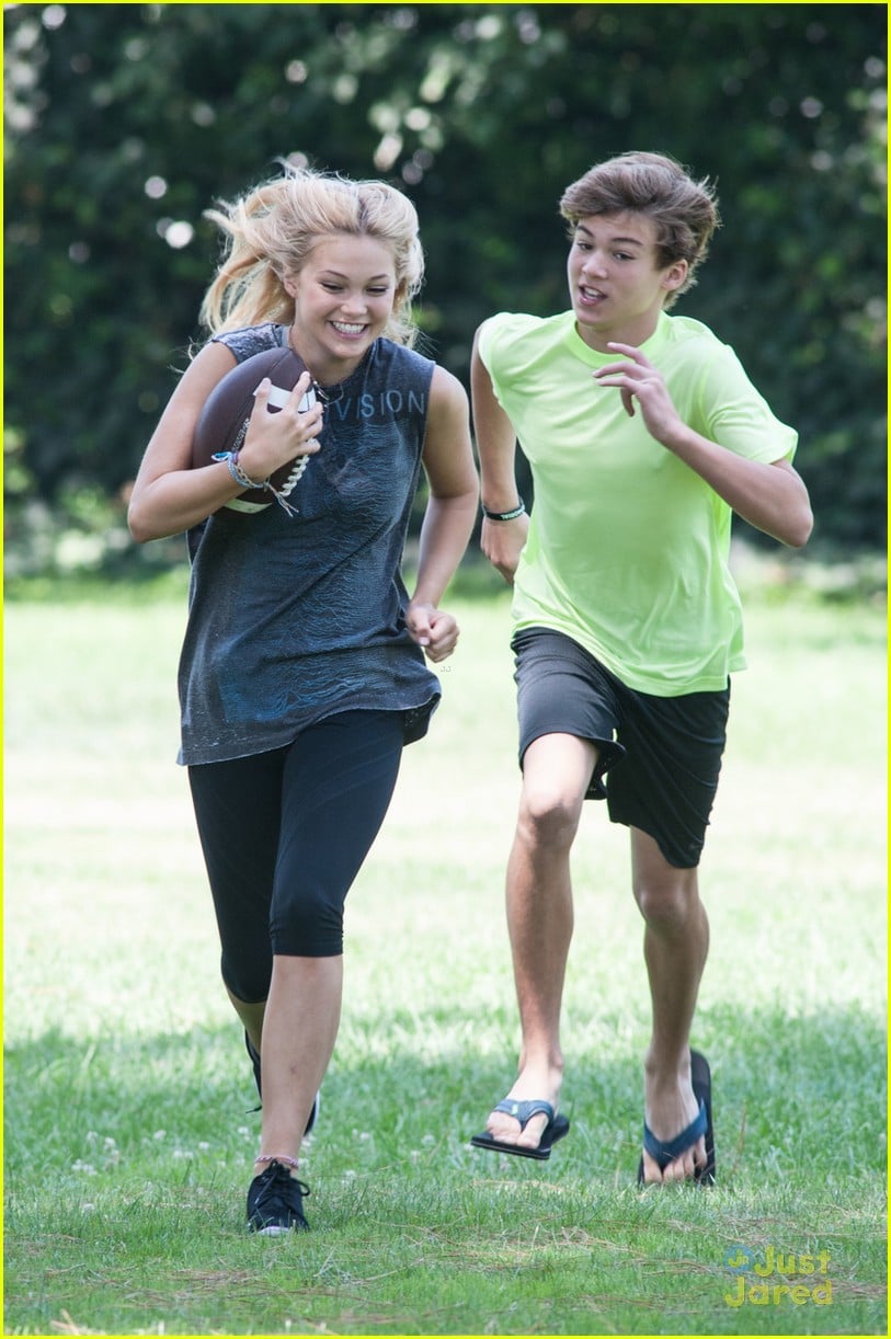Olivia Holt's Brother Cade Carries Her Away After Playing Football In ...