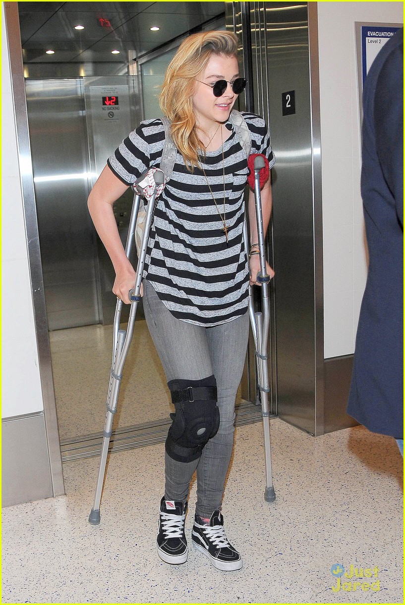 Chloe Moretz Uses Crutches For Knee Injury After Arriving Back In Los ...