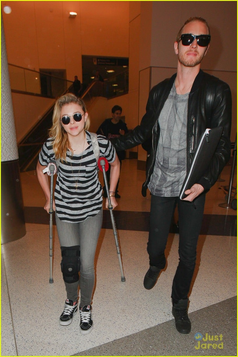 Chloe Moretz Uses Crutches For Knee Injury After Arriving Back In Los ...