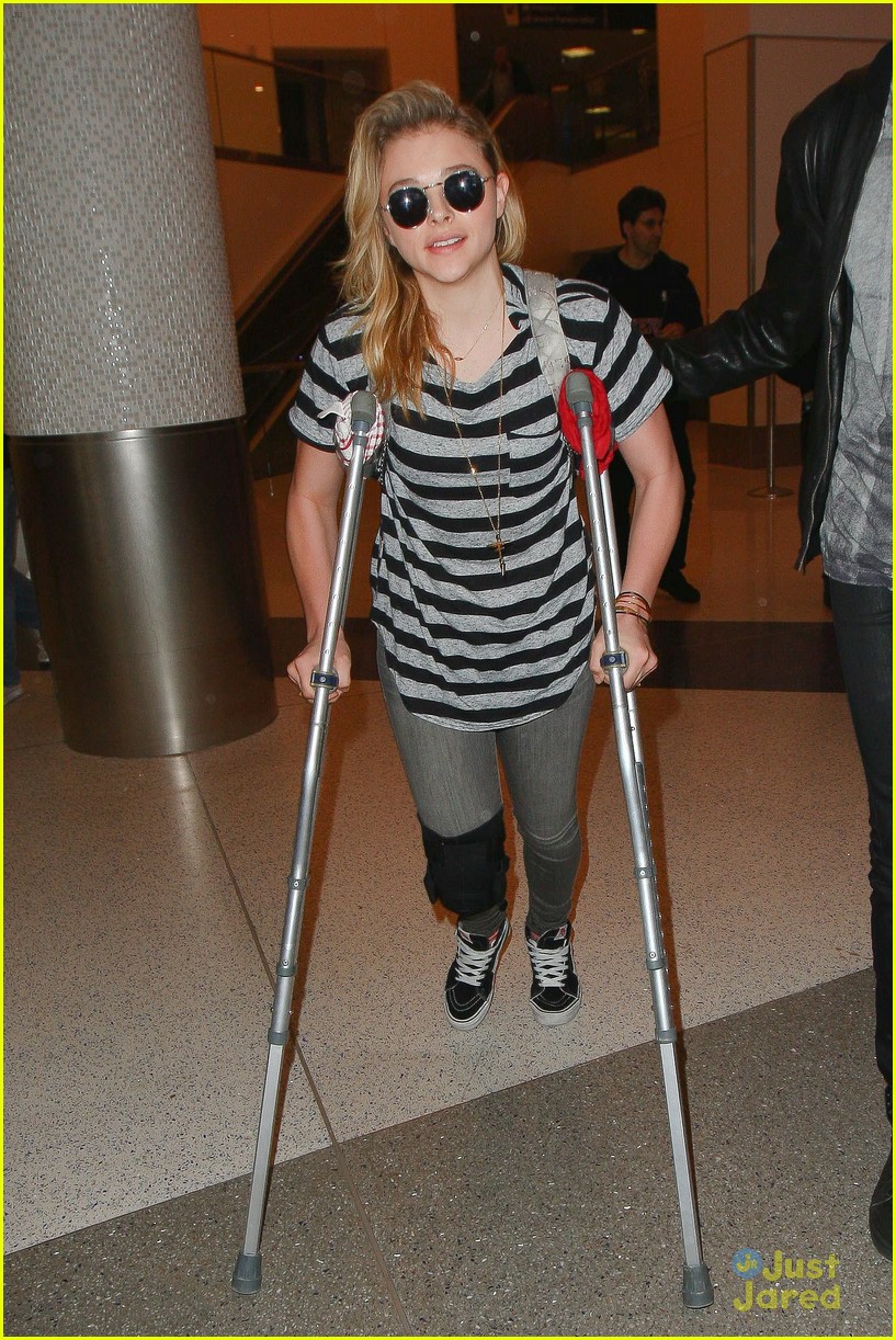 Chloe Moretz Uses Crutches For Knee Injury After Arriving Back In Los ...