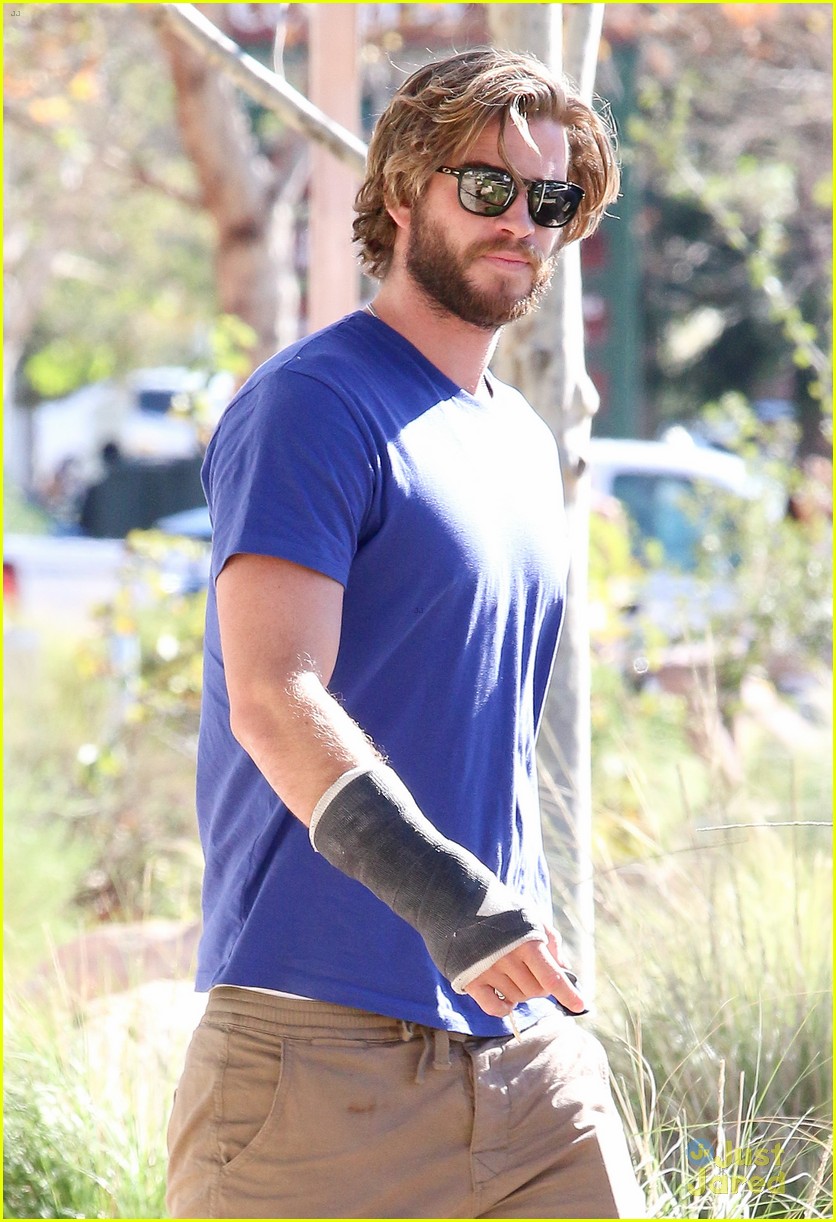 Liam Hemsworth Continues to Sport Cast Right Before Valentine's Day ...