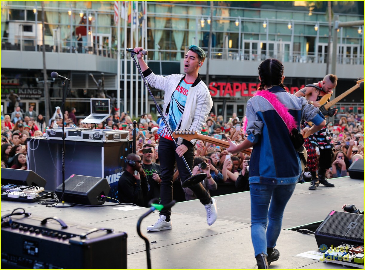 DNCE Gifts Selena Gomez With A Christmas Stocking At Jingle Ball LA ...