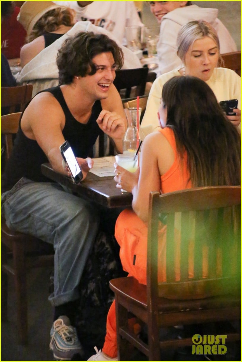 Full Sized Photo of addison rae cuddles a cute puppy while out to ...