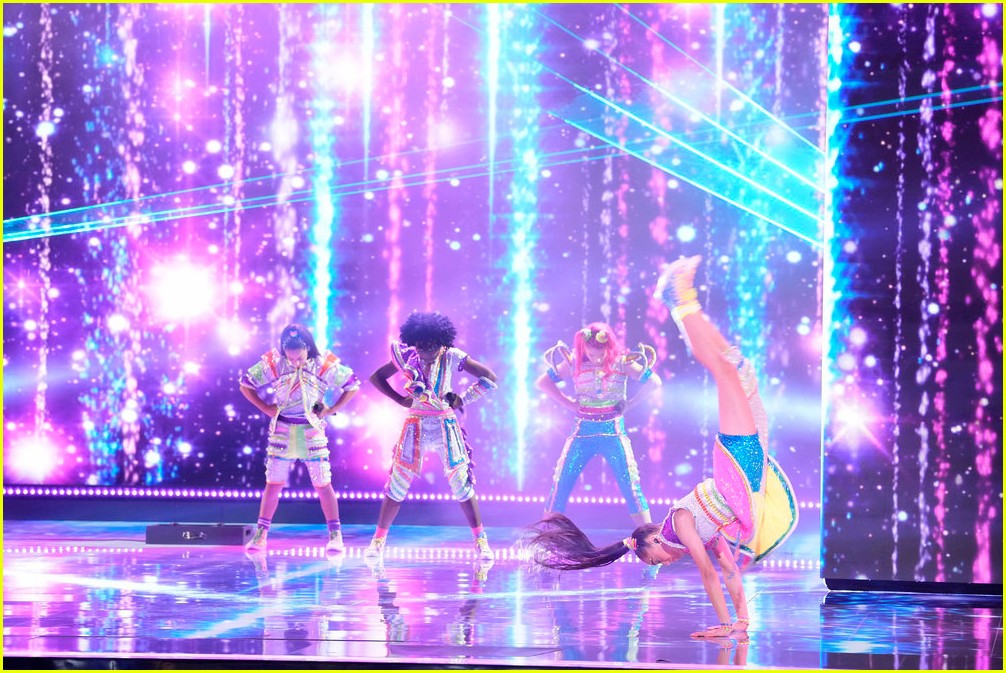 Full Sized Photo of xomg pop give electrifying performance of merry go ...