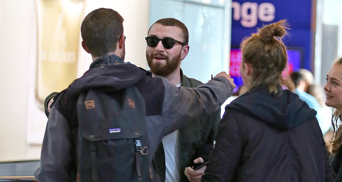 Sam Smith Is Welcomed With Hugs Upon London Landing | Sam Smith | Just ...